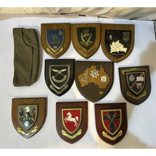 Nine Regimental and other shield plaques; a quantity of pictures.