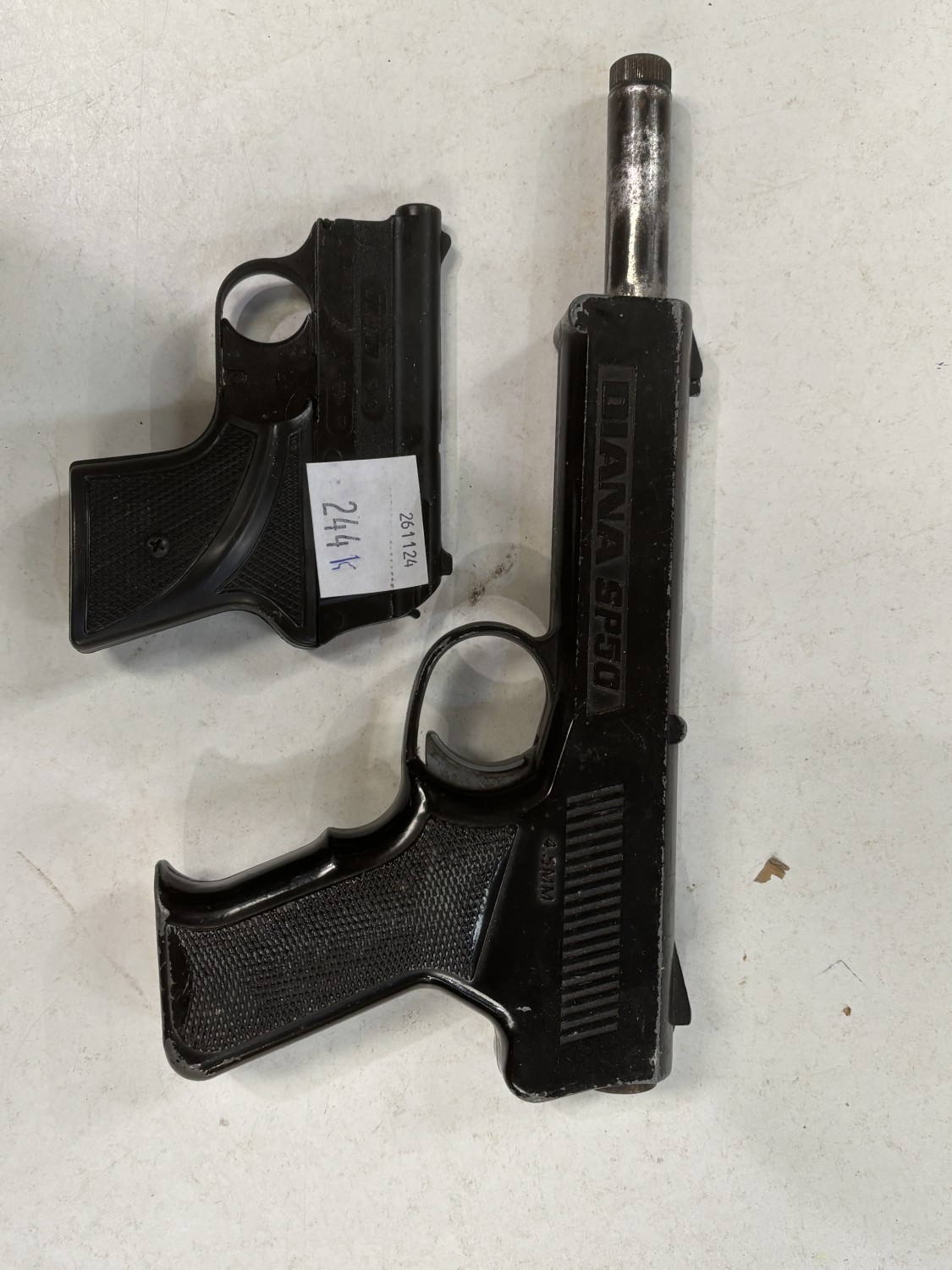 A Diana SP50 air pistol and a Domino 310 starter pistol