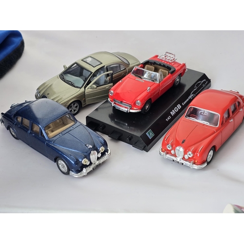 4 die-cast metal model cars. 2 x Hongwell, Red MGB on plinth & gold Jag ...