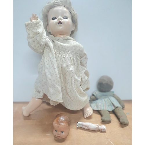 Two old/antique dolls together with a bisque dolls head and a small ...