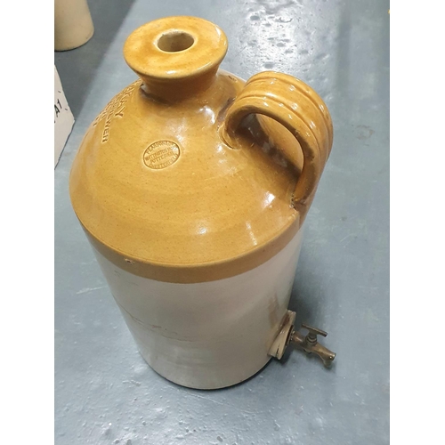 Large stoneware flagon with tap to base, marked G.H.Kay of Bury 46cm tall