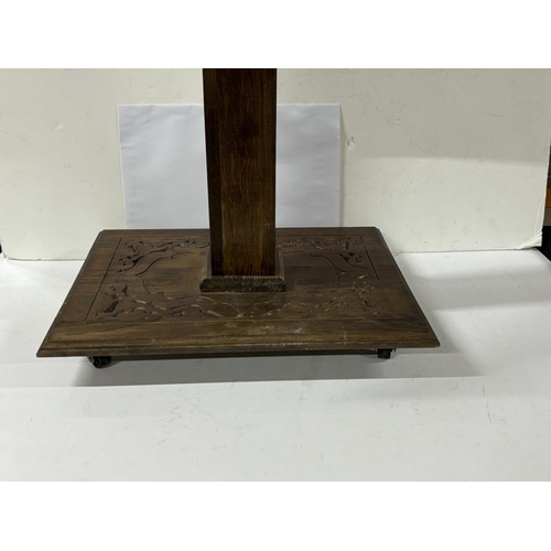 Small Wooden prayer stand, nicely carved and on wheels