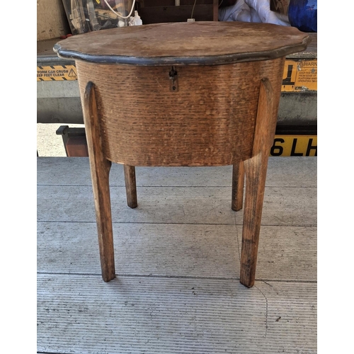 Mid 20thC circular wooden, free-standing sewing table.