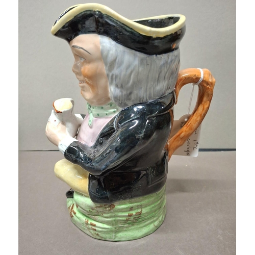Two early Victorian Staffordshire relief moulded jugs together with a ...