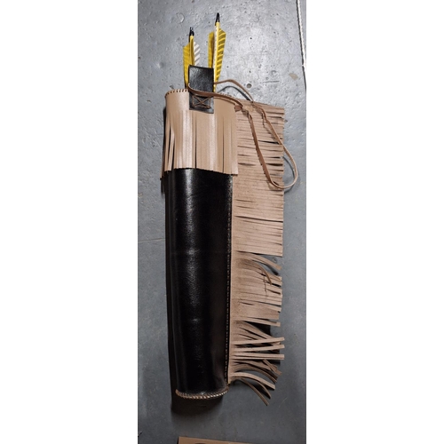An Ash bow, arrows and a quiver together with a box full of archery books