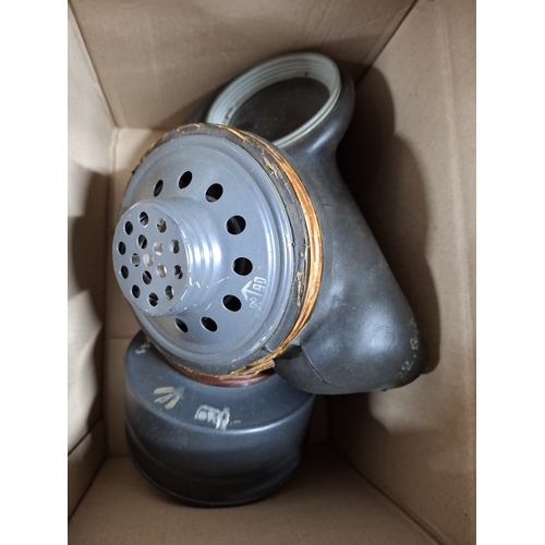 British military issue gas mask together with home guard ephemera and a ...