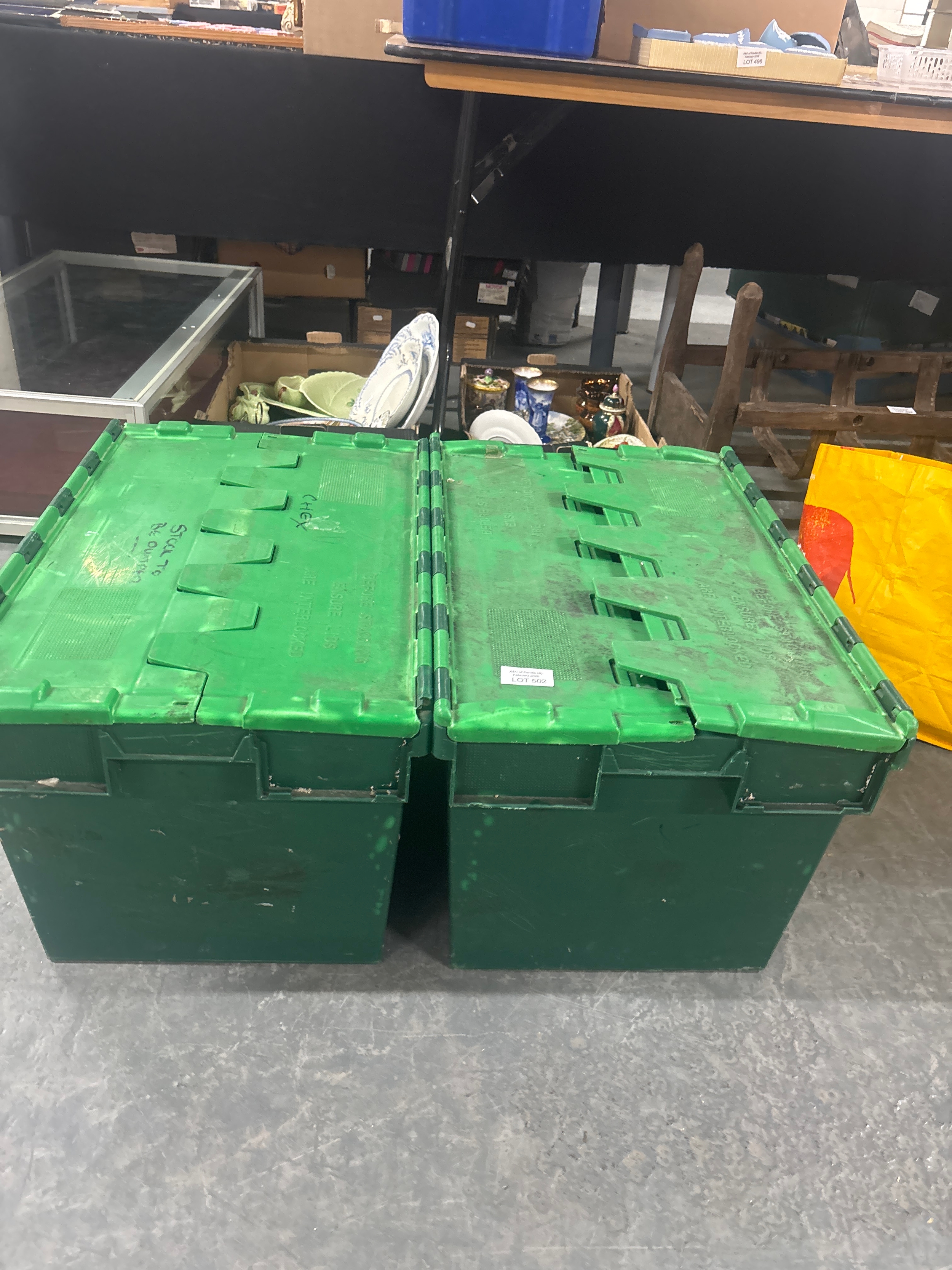 2 large green plastic boxes