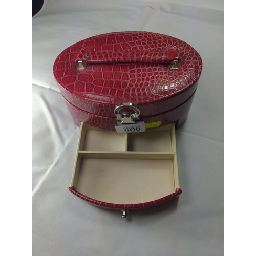 Red oval jewellery case and contents