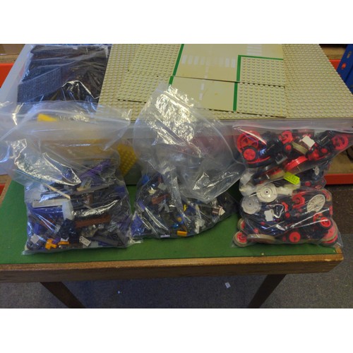Box of mixed Lego pieces, mostly sorted by colours