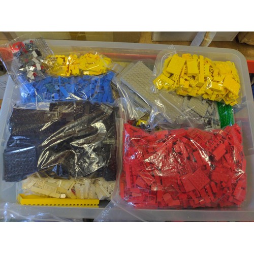 Box of mixed Lego pieces, mostly sorted by colours