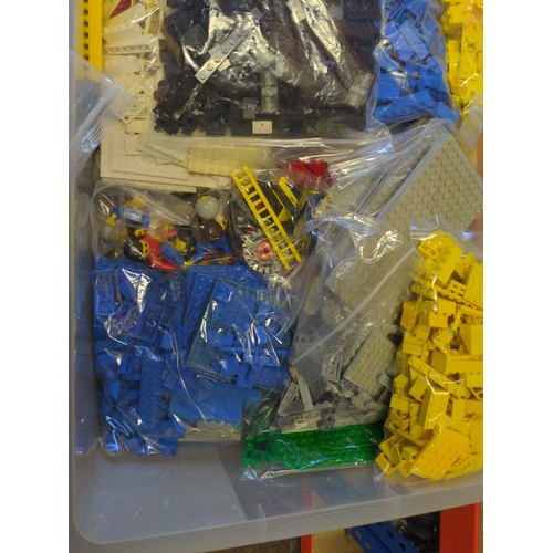 Box of mixed Lego pieces, mostly sorted by colours