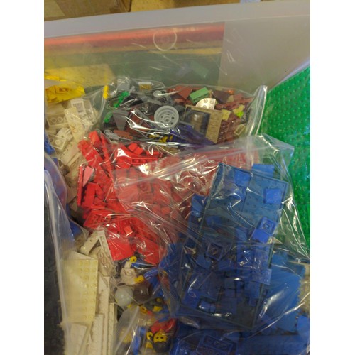 Box of mixed Lego pieces, mostly sorted by colours
