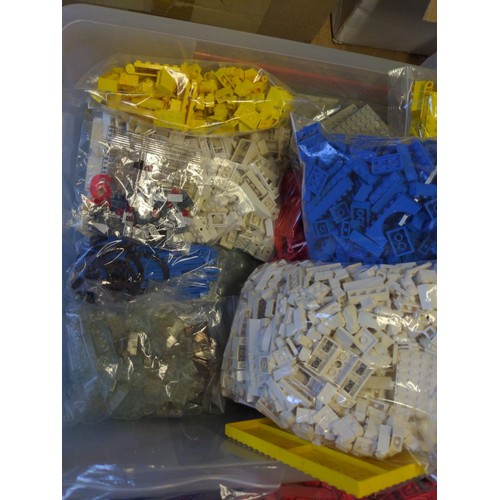 Box of mixed Lego pieces, mostly sorted by colours