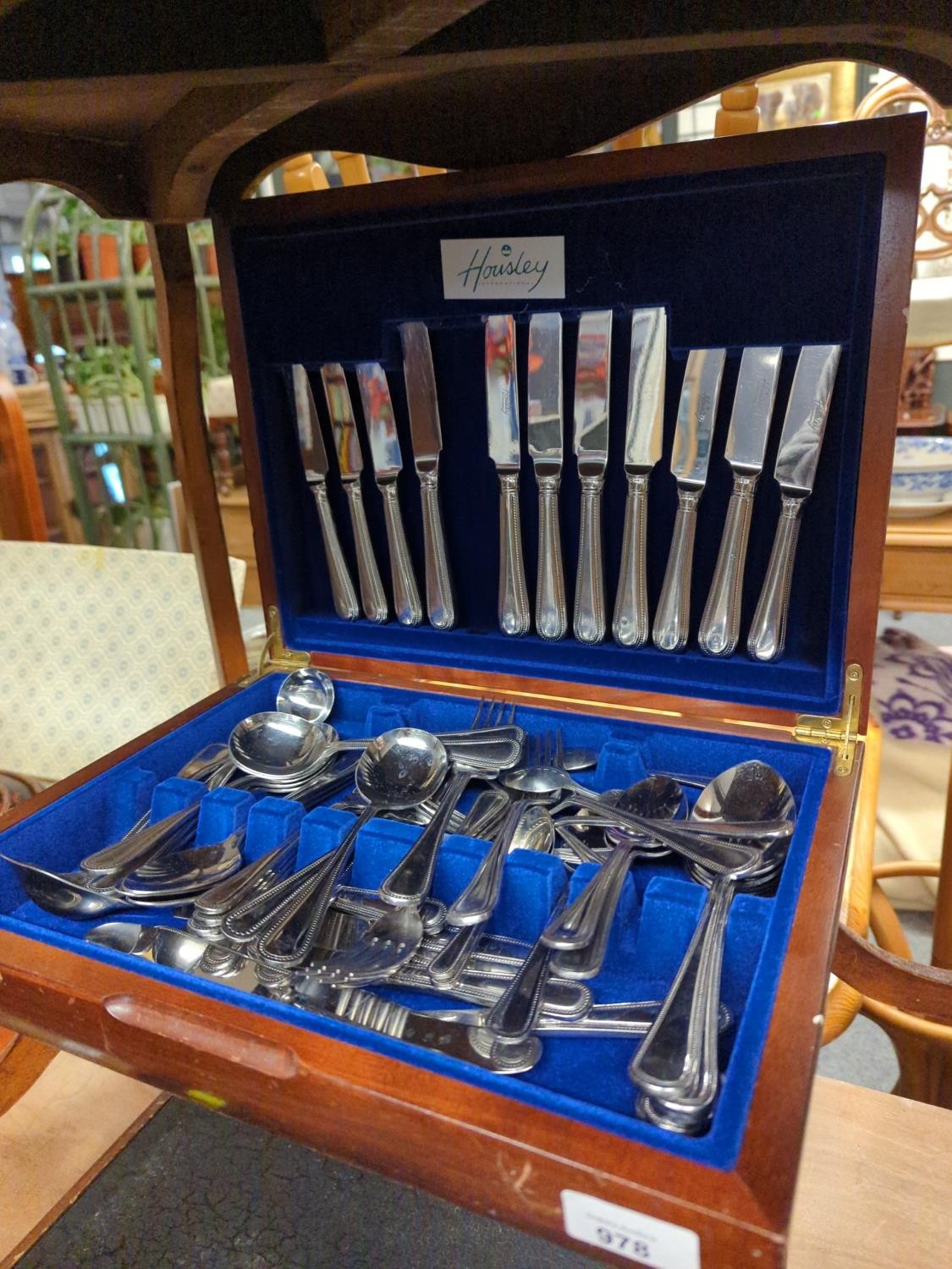 Housley canteen of stainless steel cutlery six place setting in wooden box.