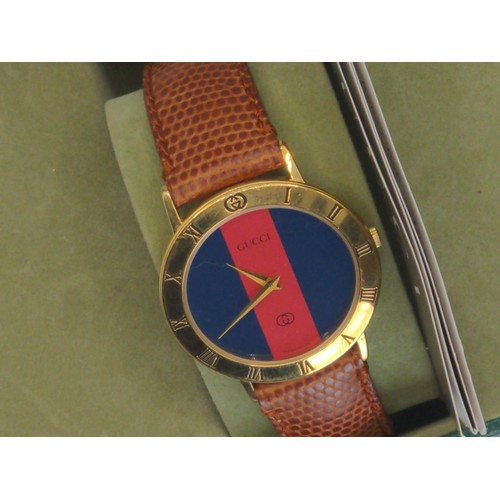 Gucci quartz watch, model no. 3000M BRB, serial no. 187928, with blue and red dial, case diameter 33