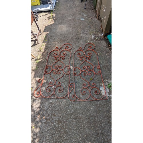 Pair of red-painted French-style wrought iron scrolled panels. H130cm ...