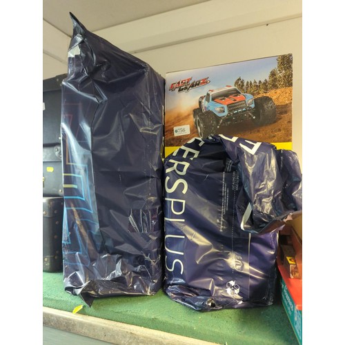 4 x new, boxed Fast Gearz Rally Titan RC cars.