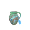 Late 19th century C H Brannam pottery Barum ware jug, decorated with ...