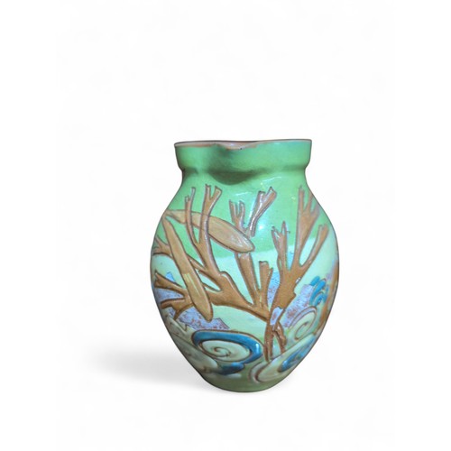 Late 19th century C H Brannam pottery Barum ware jug, decorated with ...
