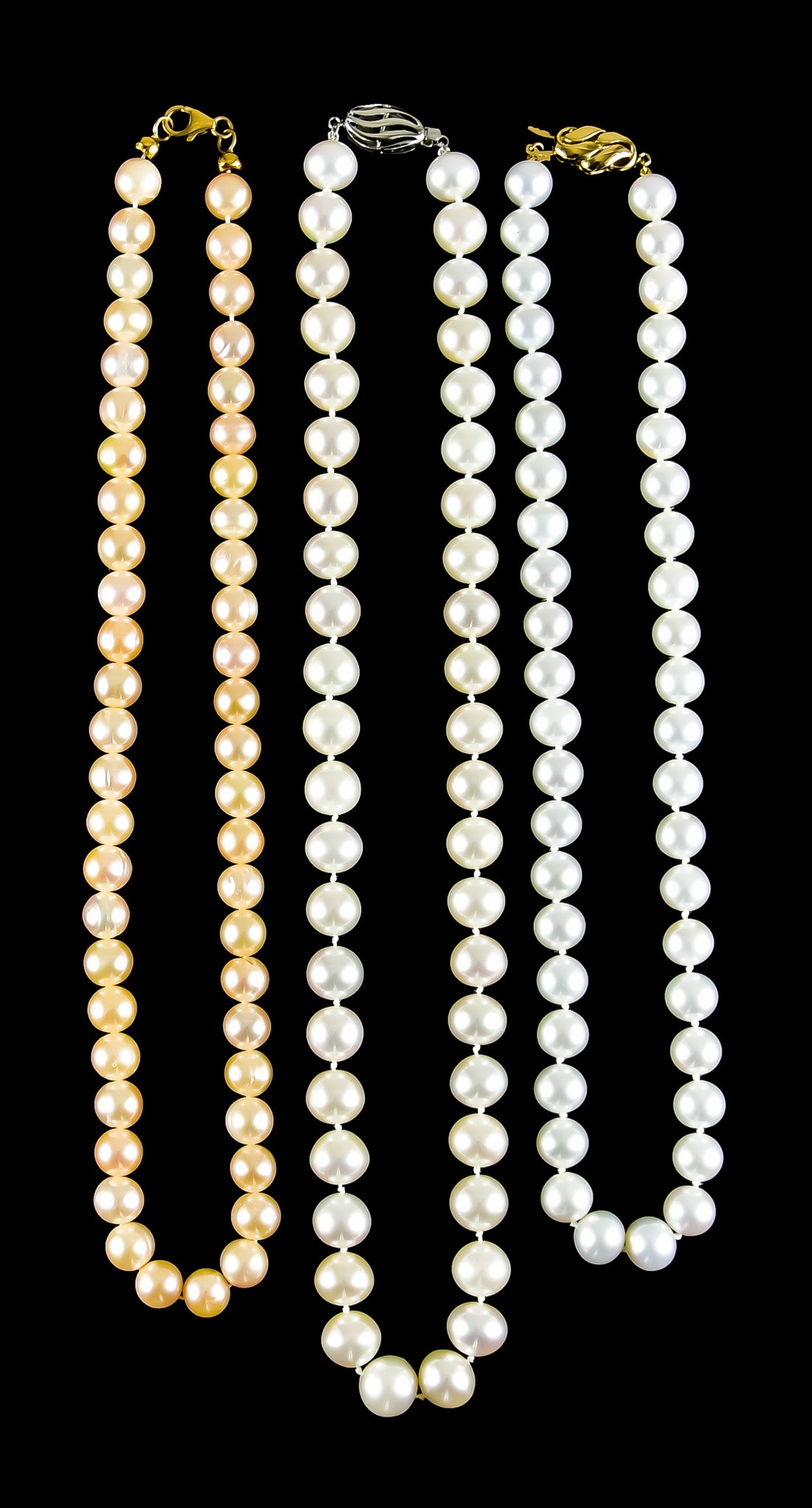 Three Strings of Cultured Pearls, two white, one pink, lengths 420mm ...