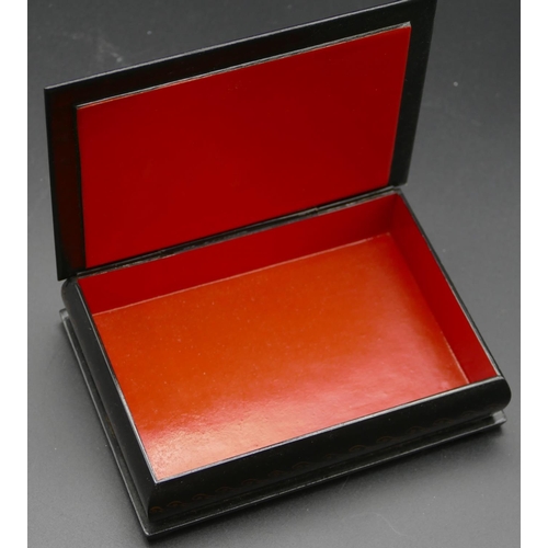 A Russian black lacquered box with hinged lid depicting church with ...