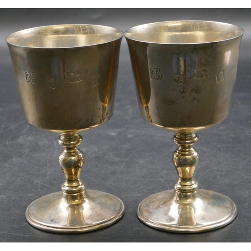 A pair of modern silver goblets on turn stemmed round bases, maker's ...