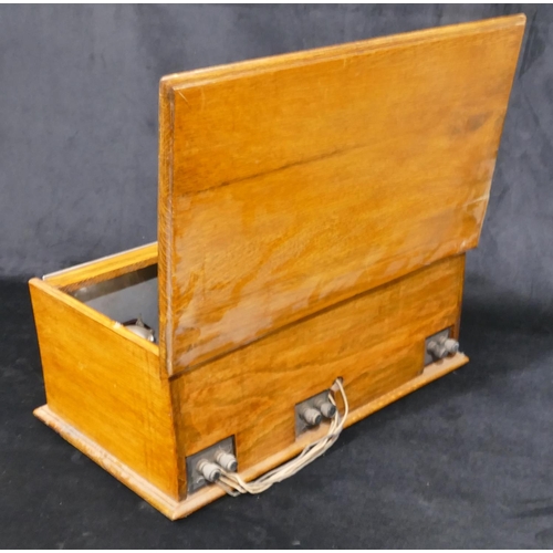 An oak 1920's style rectangular shaped radio with hinged lid (interior ...