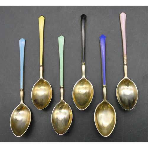 A set of 6 silver gilt and coloured enamelled teaspoons in fitted black ...