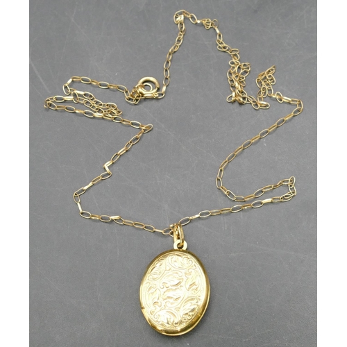 An oval 9ct gold locket with engraved decoration with chain, 2.8 grams ...