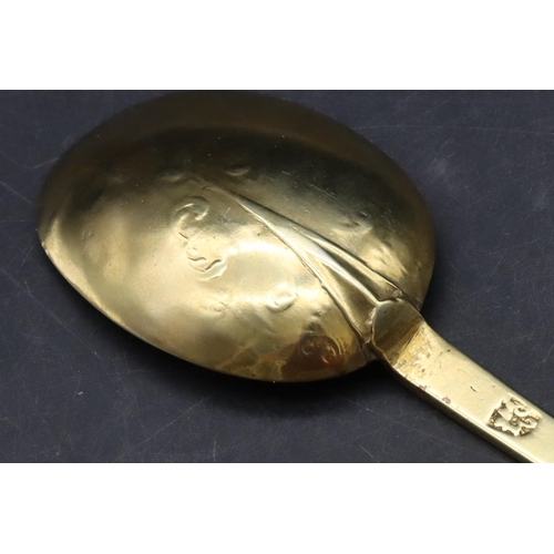 A 17th Century Trefid pattern silver gilt spoon with raised scroll ...