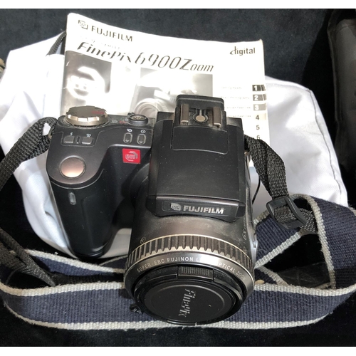 A Fujifilm FinePix S9500 camera with manual, a Fujifilm FinePix 6900 ...