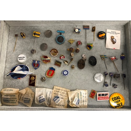 Various badges and pins, including Fiat Iveco, ERF Trucks, SKAL, Rotary ...