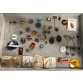 Various badges and pins, including Fiat Iveco, ERF Trucks, SKAL, Rotary ...
