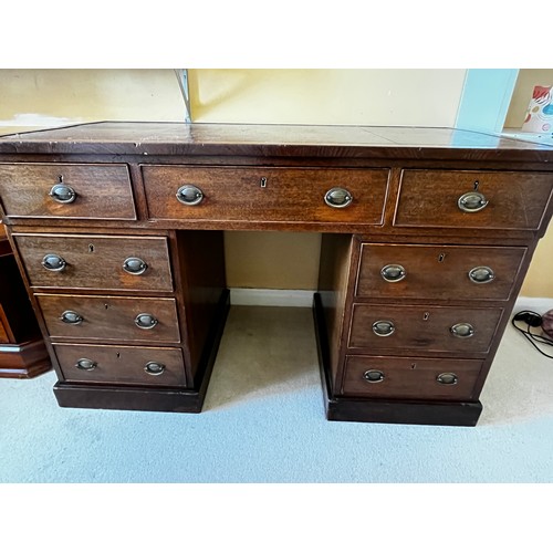 NOT HELD BY PFW. A Mahogany pedestal desk with red leather top, 122cm ...