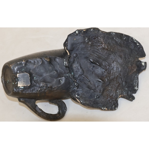 A Studio heavy sculpture of tipped over mug, unsigned, 24cm long, 9cm high