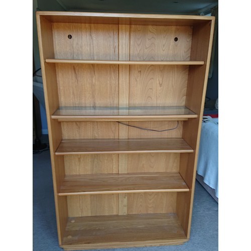 THIS ITEM IS NOT HELD BY PFW. An Ercol bookcase with display lighting ...