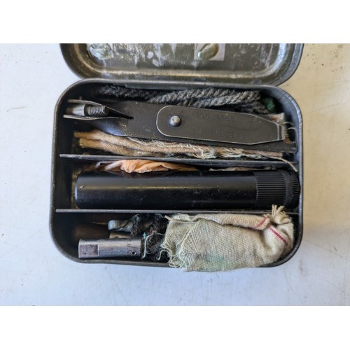 A Vintage Military Gun Cleaning Kit