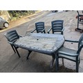 a green plastic table and 4 chair set