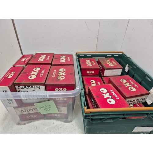 A large quantity of vintage metal oxo cube containers