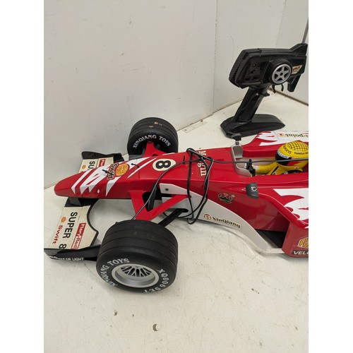 A large RC Formula 1 car with controller