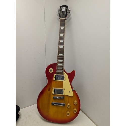 A Godman electric guitar in a Martin & co case