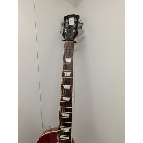 A Godman electric guitar in a Martin & co case
