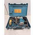 A Makita HR2510 110v SDS drill in case