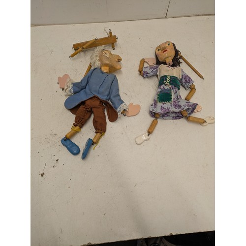 A pair of puppet figures