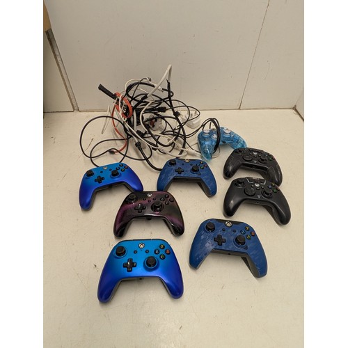 A large selection of various gaming controllers