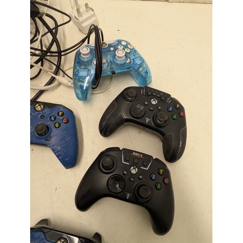 A large selection of various gaming controllers