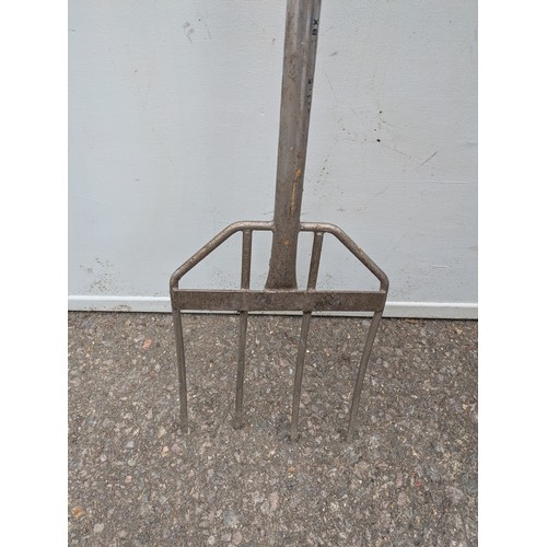 A stainless steel pitch fork