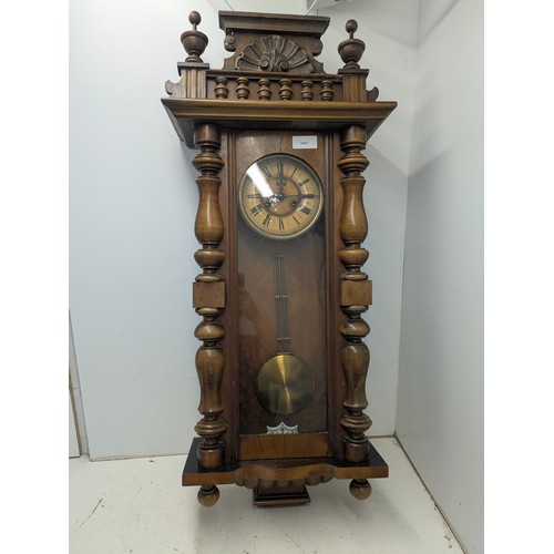 A Victorian mahogany wall mounted pendulum clock
