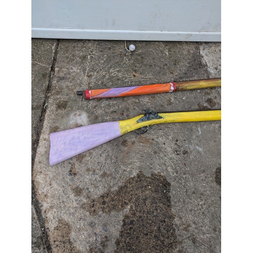 A pair of replica flintlock rifles