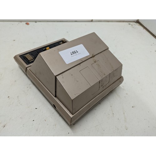 A retro Tomy Grandatan Caveman handheld game console